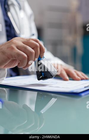Doctor putting medical seal on prescription paper, giving medicine to ...