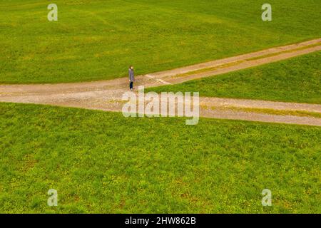 Woman at the crossroads. Aerial view Stock Photo - Alamy