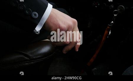 Businessman shifting gear sitting in car Stock Photo - Alamy