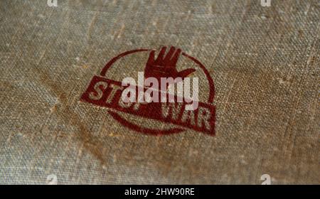 Stop war stamp printed on cardboard box. Peace, no aggression and ...