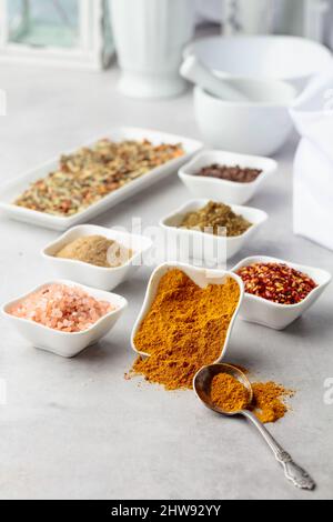 Himalayan pink salt. Kitchen salt and chili peppers. Spices on grill ...