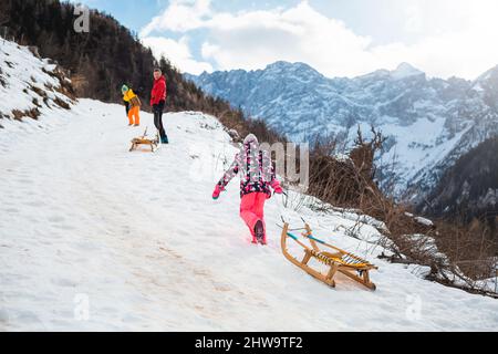 A man sleds on a snowy slope in a park, in Bucharest, Romania, Sunday ...