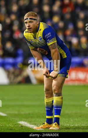 Oliver Holmes #12 of Warrington Wolves salutes the fans after the game ...