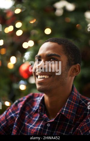 Christmas is my favourite time of year. a handsome young man getting ...