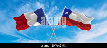 France and Chile two flags on flagpoles and blue cloudy sky Stock Photo ...