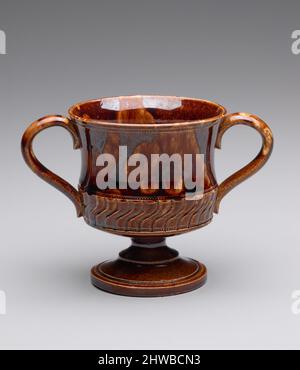 The loving cup is a ceremonial drinking vessel made of metal, featuring ...