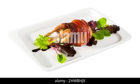 Image of baked in bacon quail with balsamic sauce on the plate Stock ...