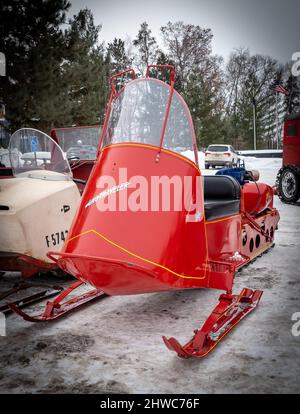 NISSWA, MN - 5 JAN 2022: Red antique Sno-Craft Pow-R-Sled NISSWA, MN - 5 JAN 2022: Red antique Sno-Craft Pow-R-Sled