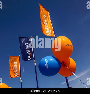 Orange and blue flags outside a Bellway Homes development, new house ...