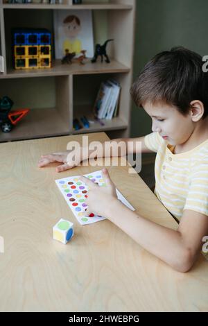 Child playing diy dot game for fingers Stock Photo - Alamy