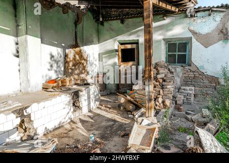 Delapidated house building construction showing layers of сement and ...