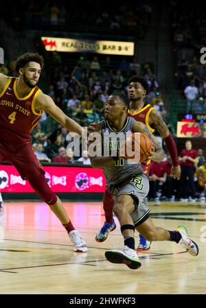 Iowa State forward George Conditt IV (4) looks to pass ahead of West ...