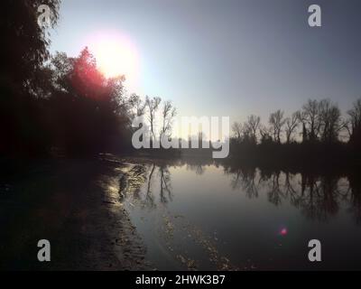 Novi Sad, Serbia - December 04. 2013: Sunset over the tributary of the ...