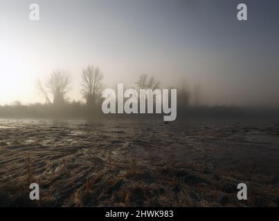 Novi Sad, Serbia - December 04. 2013: Sunset over the tributary of the ...