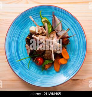 Baked lamb ribs with vegetables and figs Stock Photo - Alamy