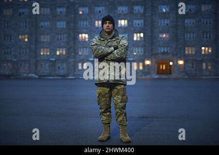 Today a cadet, tomorrow a colonel. Shot of a young soldier standing ...