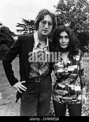 Former member of The Beatles pop group John Lennon with his wife Yoko Ono at Heathrow Airport ...