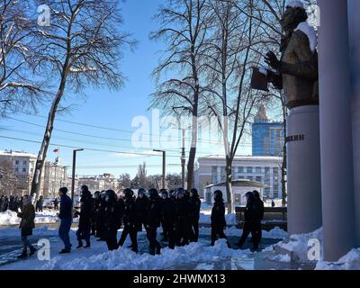About a hundred Russian anti war protesters fly a new flag, white blue ...