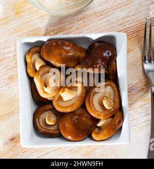 Pickled mushrooms shiitake with onions closeup Stock Photo - Alamy