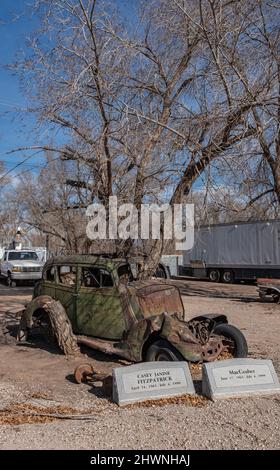 junk cars with trees growing through them Stock Photo - Alamy