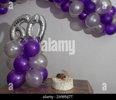 Number of white cakes with colorful decorations on a white table Stock ...