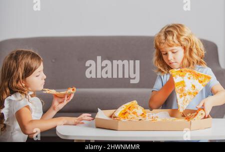 Pizza and kids, slices pizza in kids hand. Children eating tasty fast ...