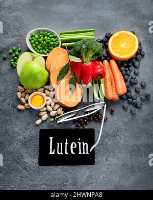 Foods high in lutein on dark background. Food for healthy eyes. High in ...
