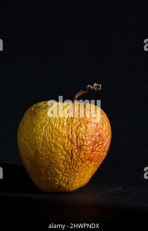 A decaying, wrinkled golden apple (slightly decayed Stock Photo - Alamy