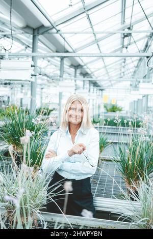 Smiling scientists looking at camera arms crossed in laboratory Stock ...