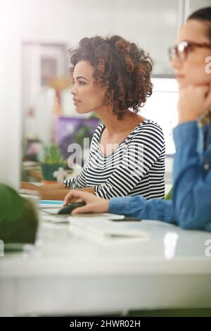 Cropped shot of young professional businesswomen working on their ...