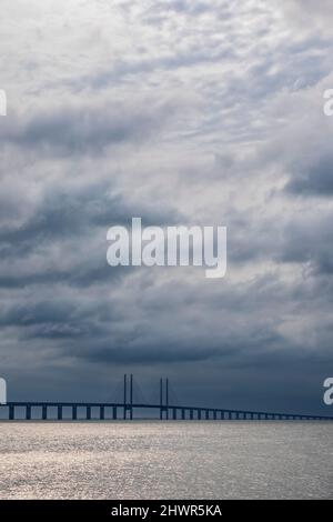 Cloudy sky over Sound strait with silhouette of Oresund Bridge in ...