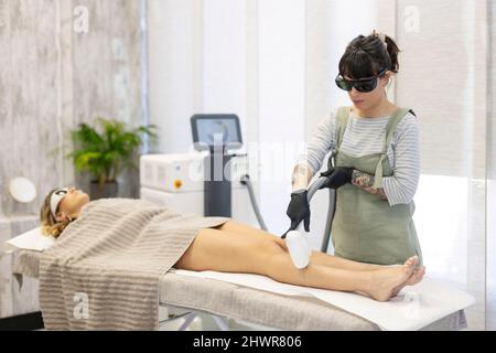 Laser hair removal on back of head of man Stock Photo - Alamy