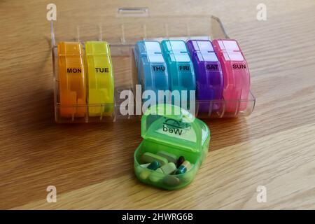 Pill box with medicine tablets to organise daily dose of medicine Stock ...