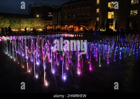 London's Granary Square fountain and neon colorful lights Stock Photo ...