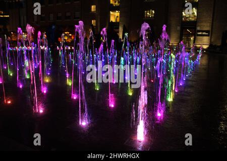 London's Granary Square fountain and neon colorful lights Stock Photo ...