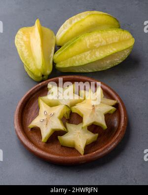 Plate of Juicy Fresh Ripe Starfruit's Cross Sections with Whole Fruit ...