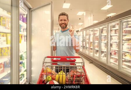 inspired with idea. customer consumer with purchases. guy at grocery ...