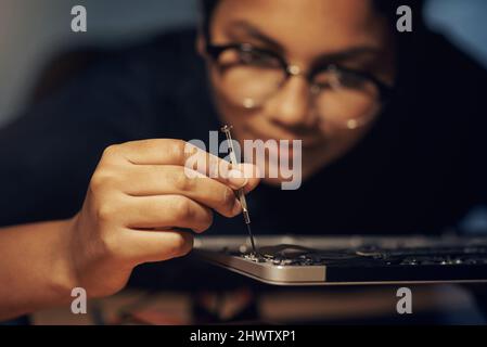 female technician service using screwdriver to repairing the air ...