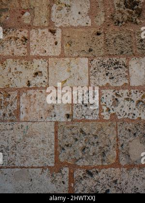 Old gray brick wall. Photo of surface of vintage stony wall. Wide angle ...