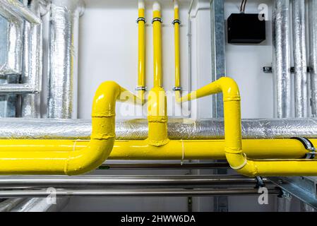 Gas and waste pipelines in the underground premises of the factory ...