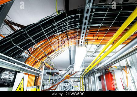 Electrical conduits system. Metal pipeline installed on ceiling wall of ...