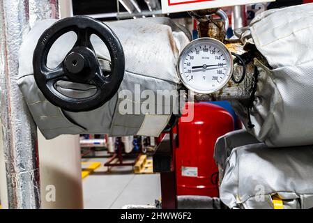 Barometers on pressure pipes, underground premises of the factory Stock ...