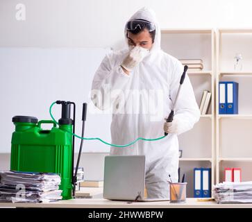 Professional contractor doing pest control at kitchen Stock Photo - Alamy