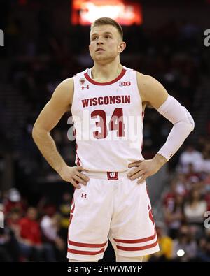 Wisconsin guard Brad Davison (34) makes a three point shot over ...