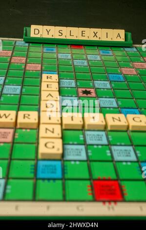 The words, 'dyslexia,' 'reading' and 'writing' are spelled out using ...