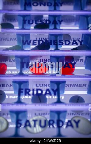 Daily doses pill box labeled with times of the day to remind the user ...