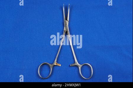 Curved haemostatic clamp. This is used to occlude blood vessels. There ...