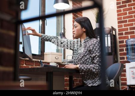 Workspace computer monitor putting on white working desk together with ...