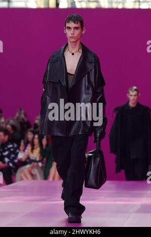 Model Frederic Bittner walks on the runway at the Balmain fashion show ...