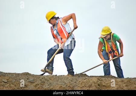 Women hard labor work danger job crush rock poverty Stock Photo - Alamy